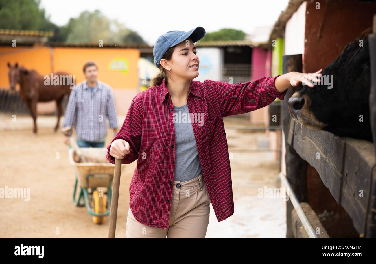Young european farmer standing near cow barnes Stock Photo - Alamy