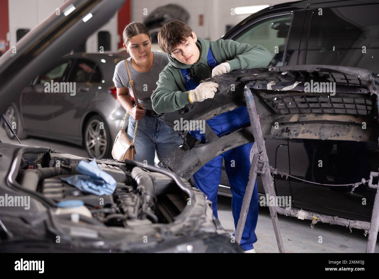 Mechanic talking to a car owner hi-res stock photography and images - Alamy