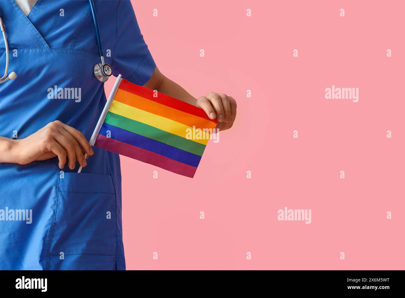 Female doctor with LGBT flag on pink background, closeup Stock Photo ...
