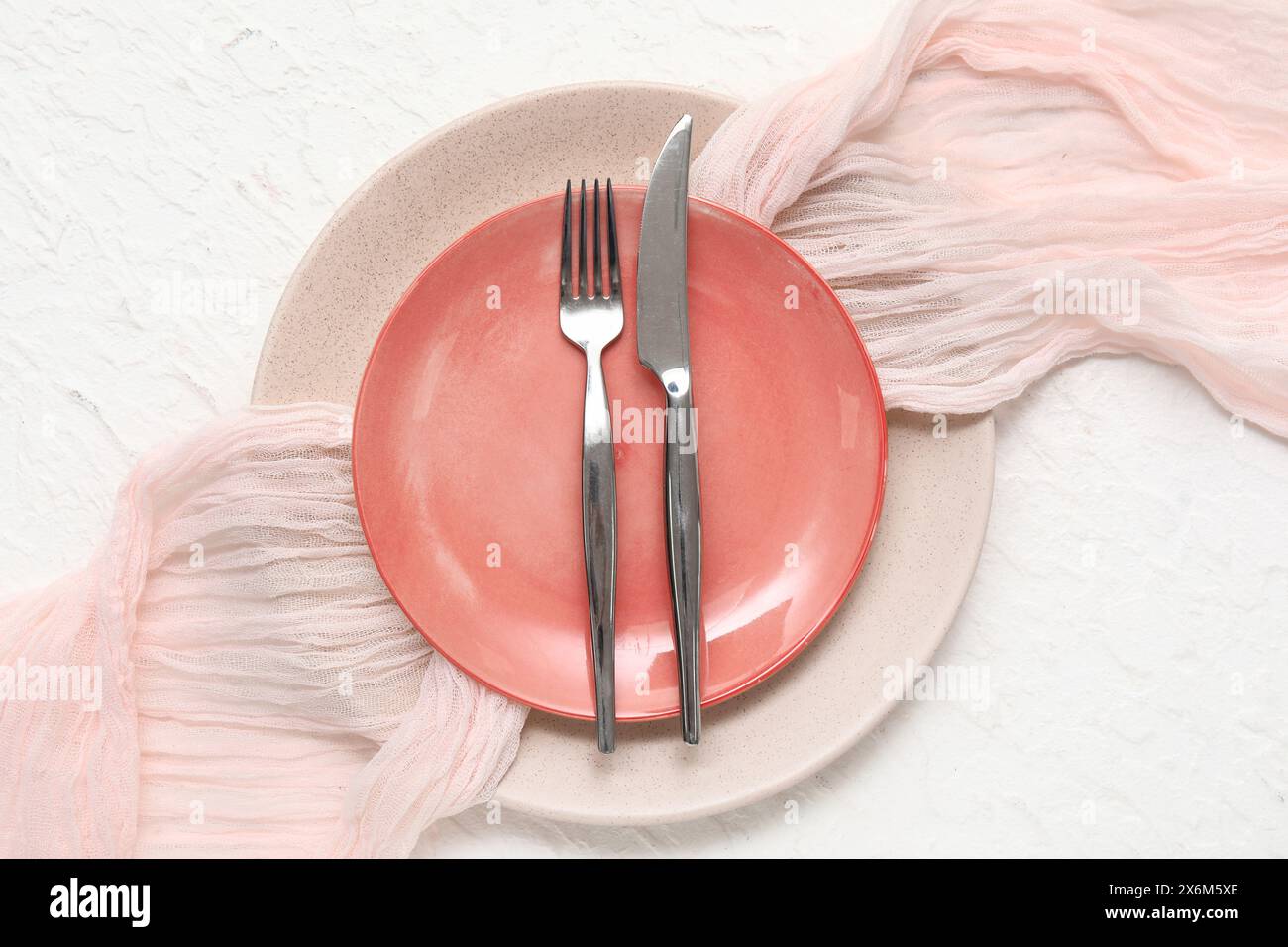 Beautiful table setting on white background Stock Photo - Alamy