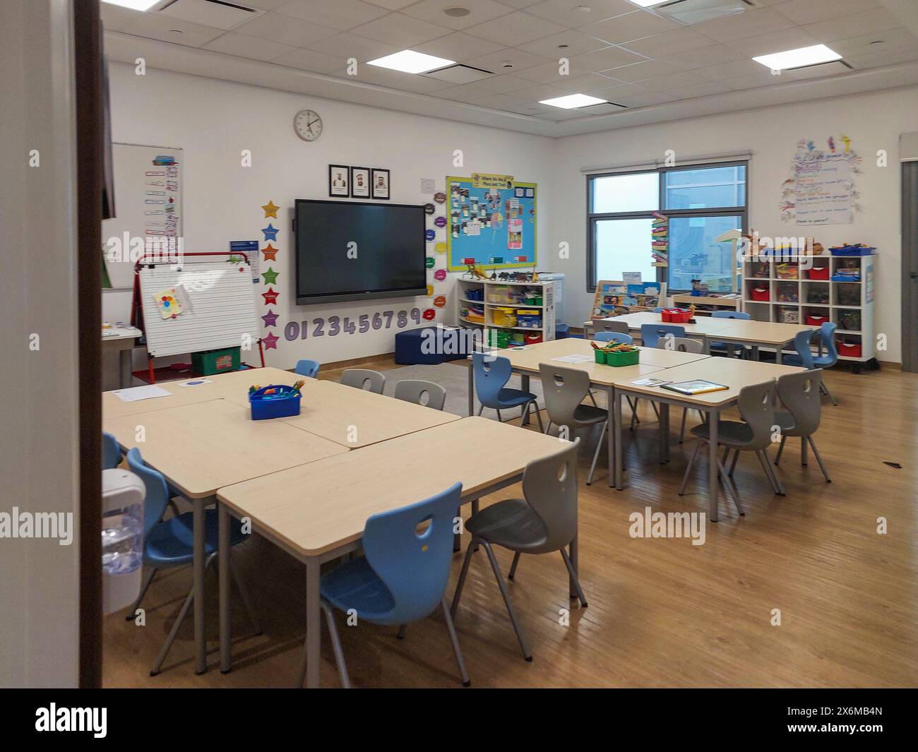 Empty classroom with chairs and tables in campus. Daycare center ...