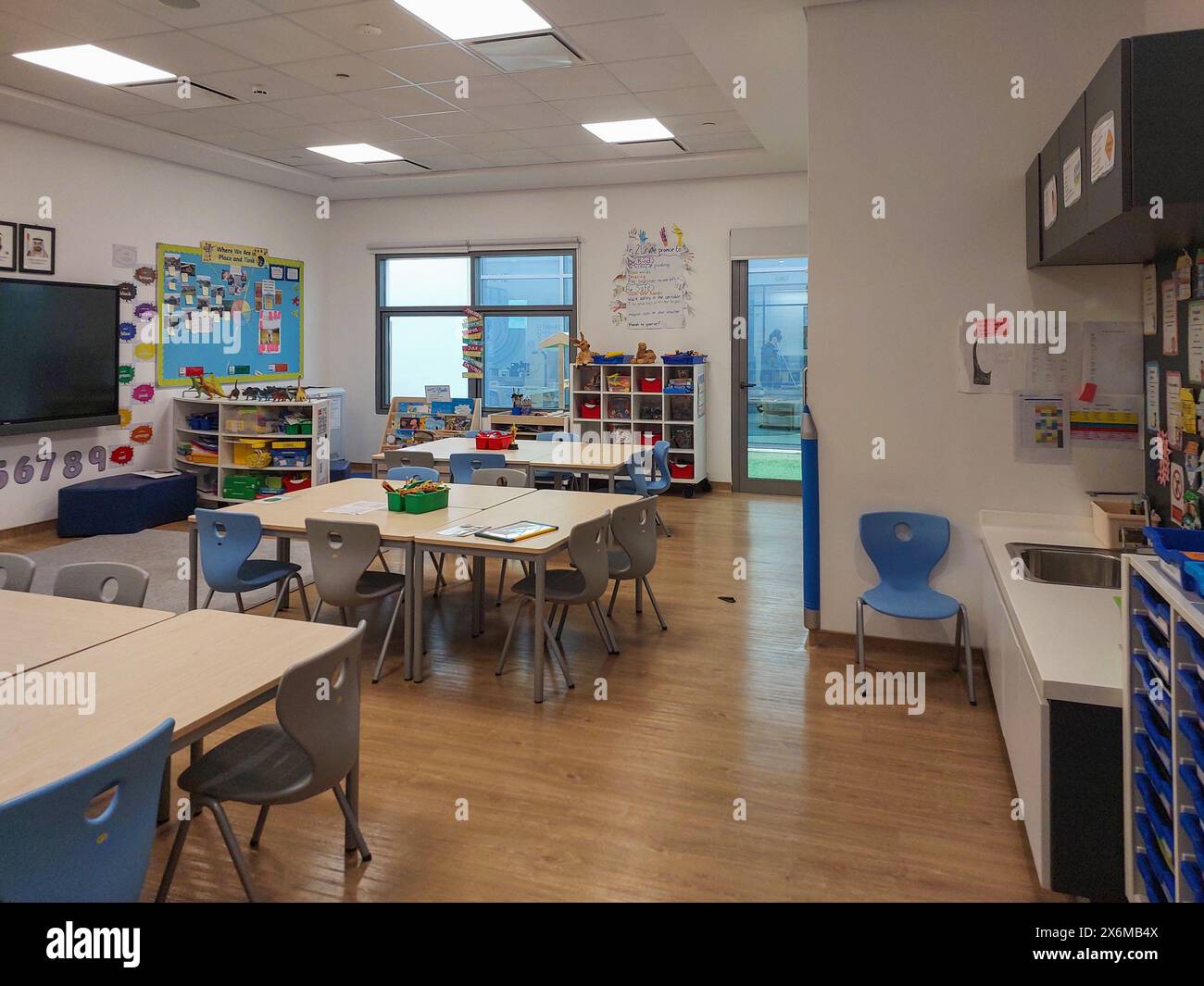 Empty classroom with chairs and tables in campus. Daycare center ...