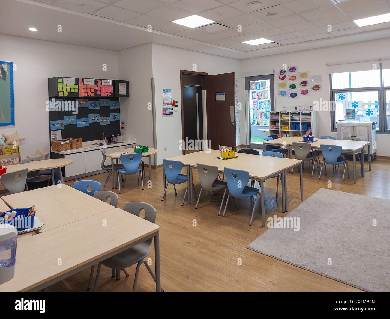 Empty classroom with chairs and tables in campus. Daycare center ...
