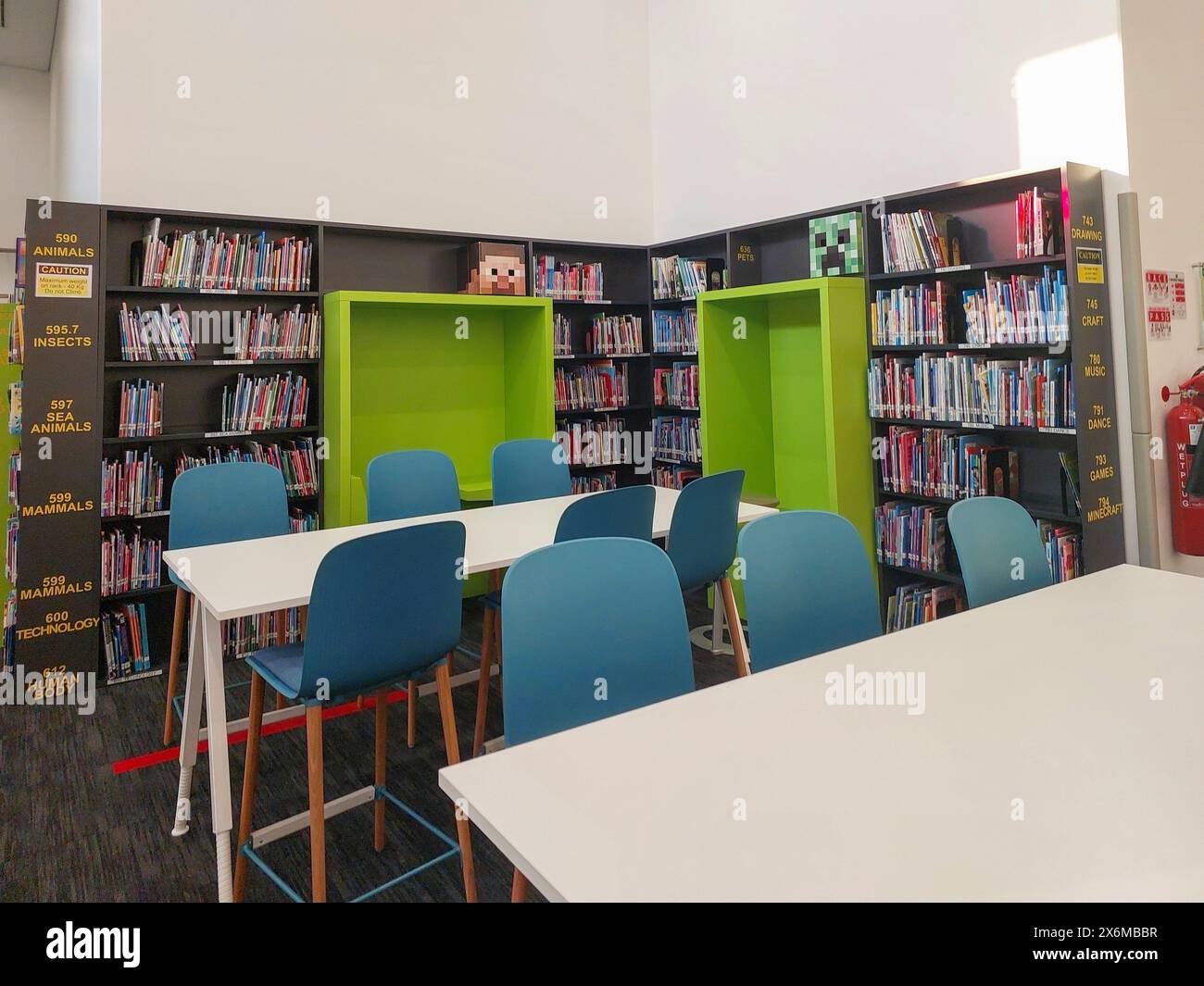 Empty classroom with chairs and tables in campus. Daycare center ...