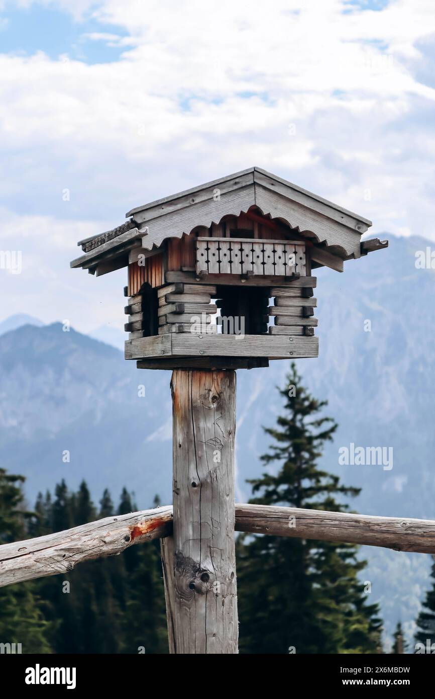 Beautiful wooden birdhouse set in the Bavarian Alps Stock Photo - Alamy