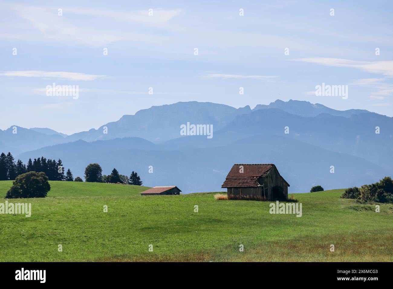 Beautiful landscapes in Bavaria - farm, green meadows and fields, Alps ...