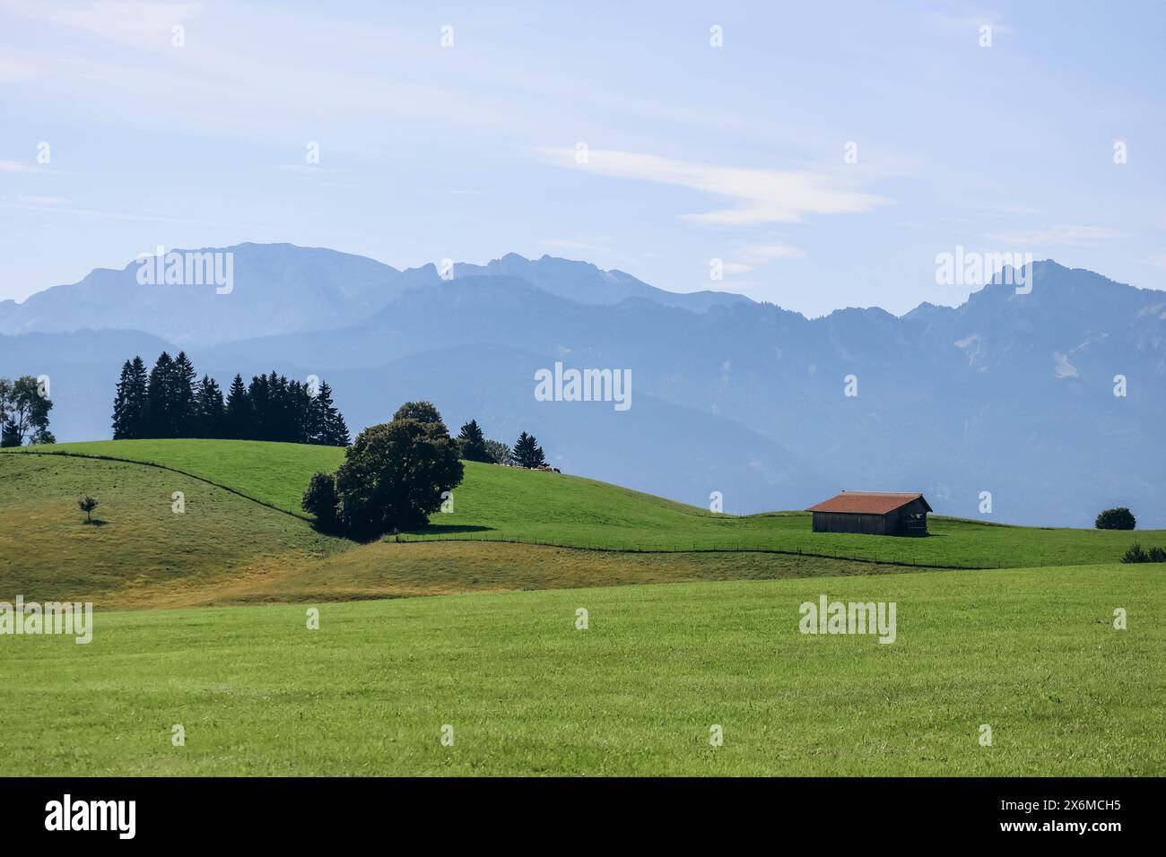 Beautiful landscapes in Bavaria - farm, green meadows and fields, Alps ...