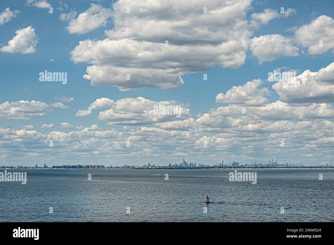 New York, NY, USA - August 1, 2023: City skyline off ocean under blue ...