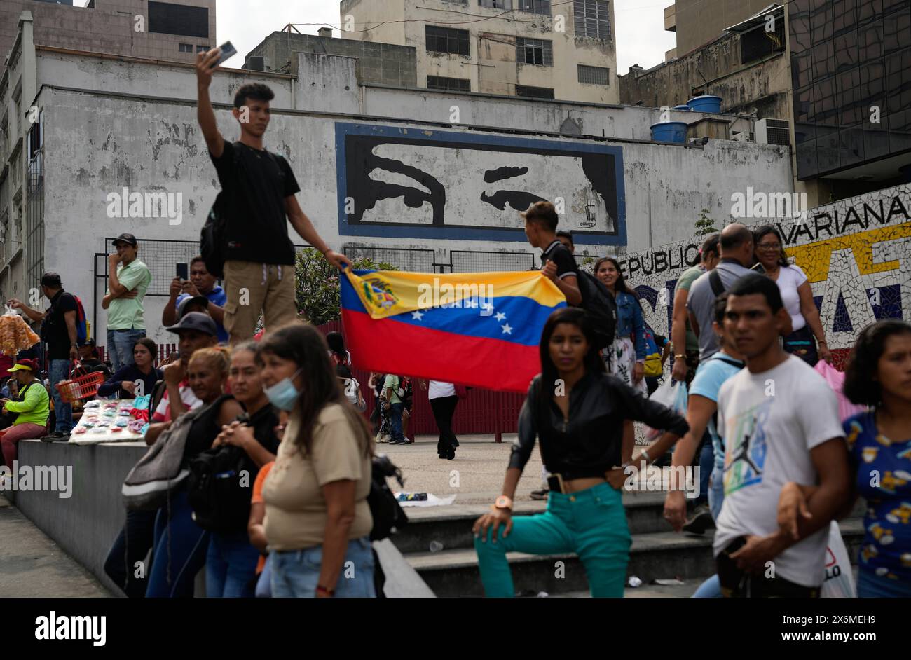 The side of a building is adorned with a mural depicting the eyes of ...