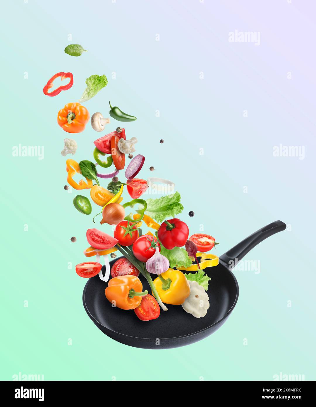 Frying pan and different vegetables in air on turquoise gradient ...