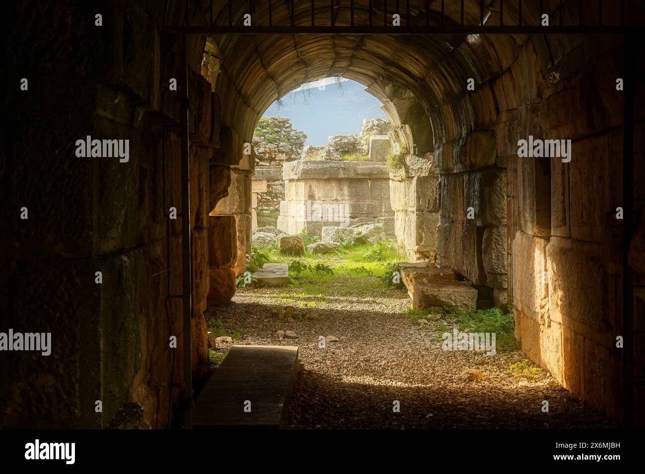 Ancient archway with sunlight illuminating stone walls and floor Stock ...