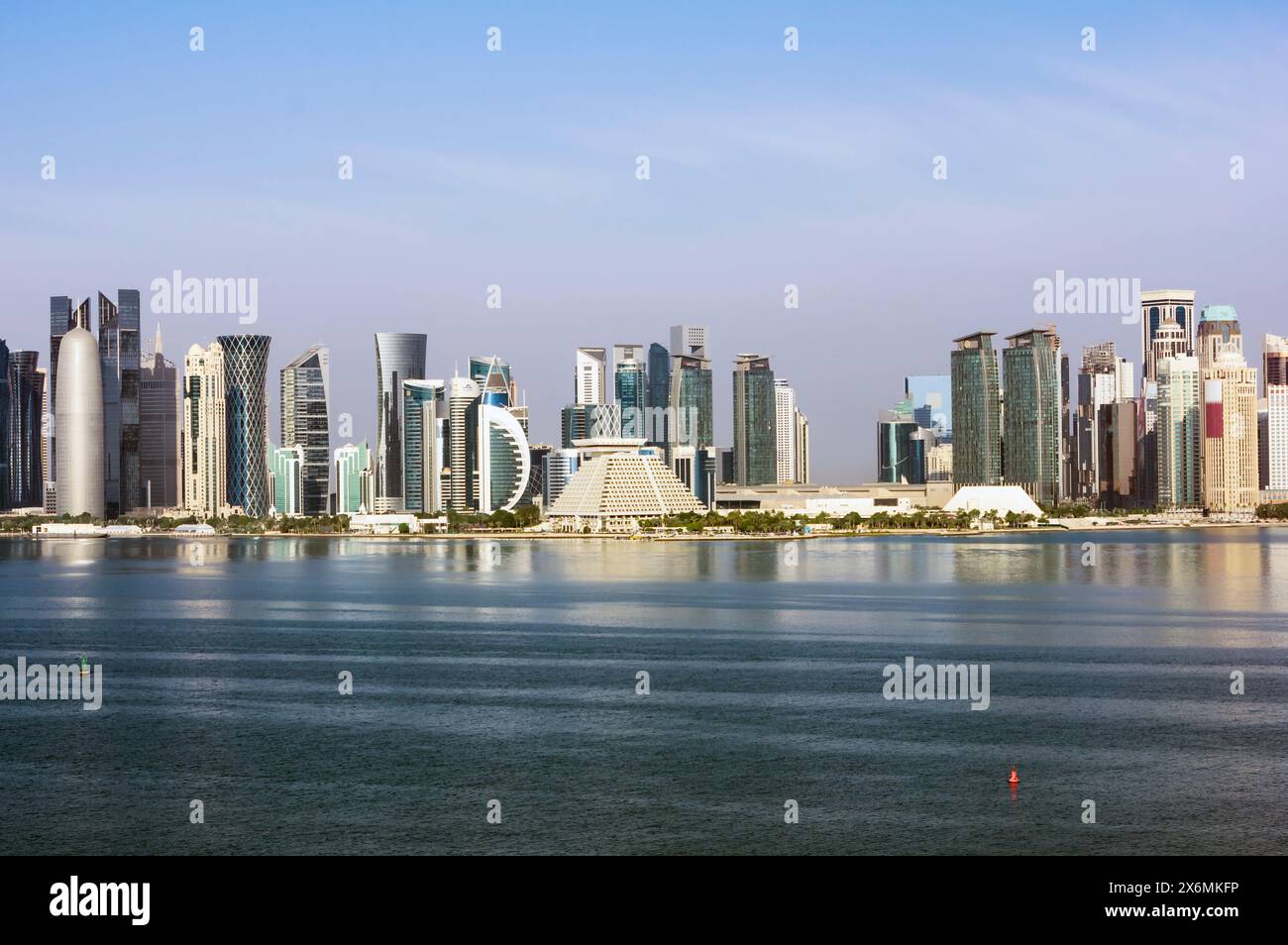 Harbor views, the Corniche with skyscrapers and ships in Doha, capital ...