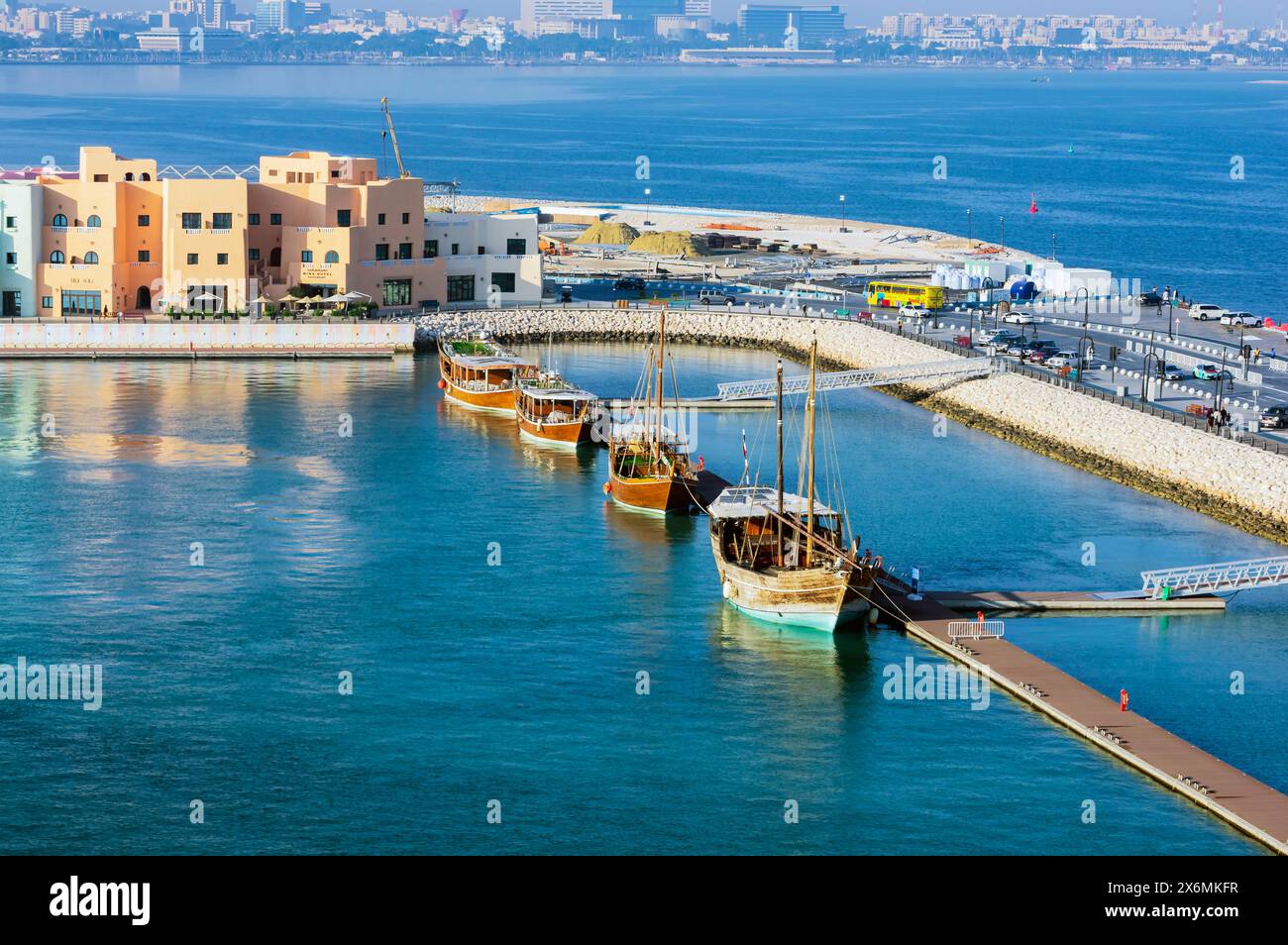 Harbor views with skyscrapers and ships in Doha, capital of Qatar in ...