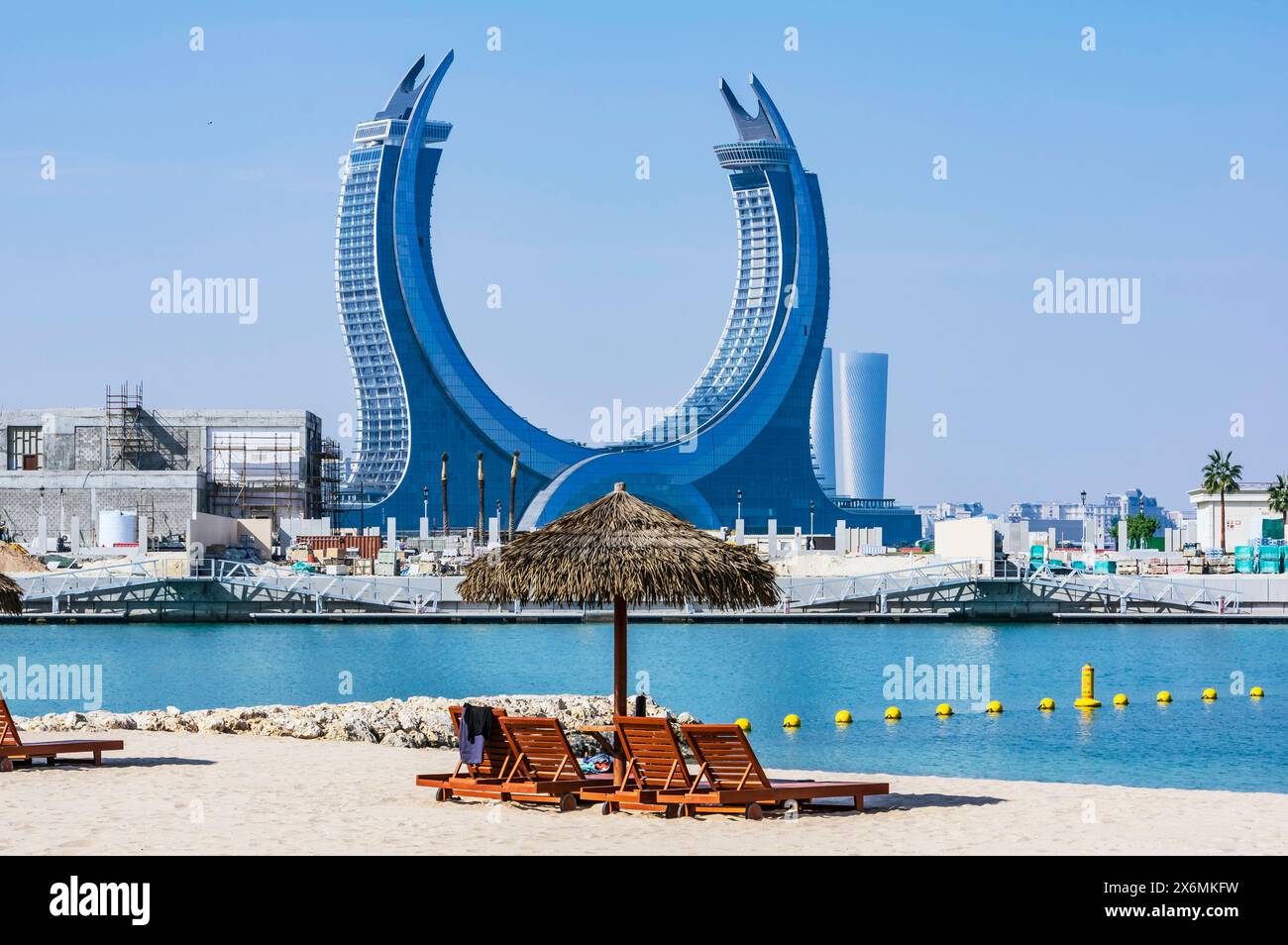 Beach in the area of The Pearl, in the background the Raffles Hotel, in ...