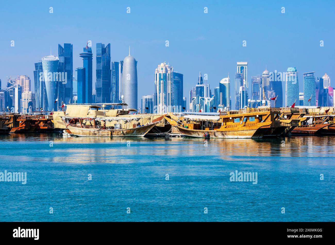 Harbor views with skyscrapers and ships in Doha, capital of Qatar in ...