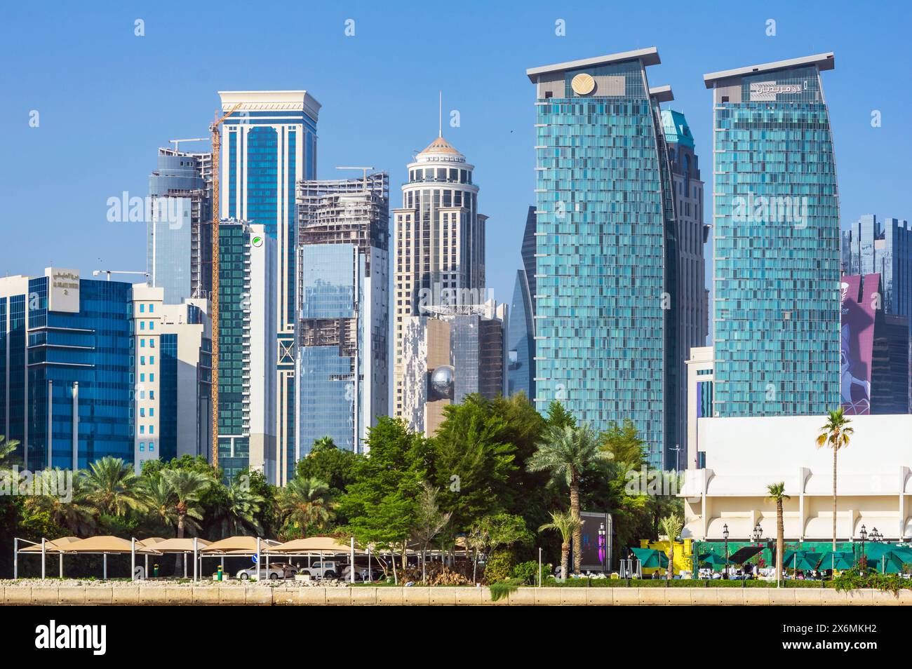 Harbor views with skyscrapers and ships in Doha, capital of Qatar in ...