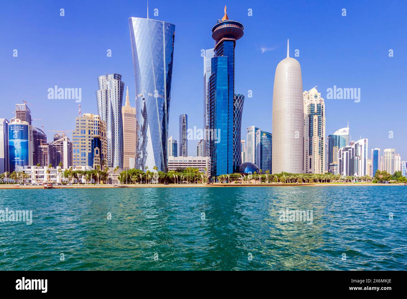 Harbor views with skyscrapers and ships in Doha, capital of Qatar in ...