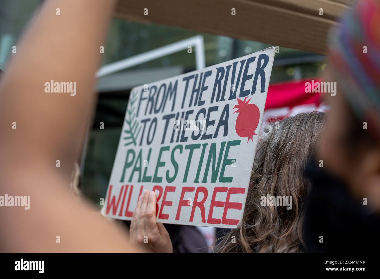 A student is seen holding a pro-Palestinian placard outside the Holborn ...