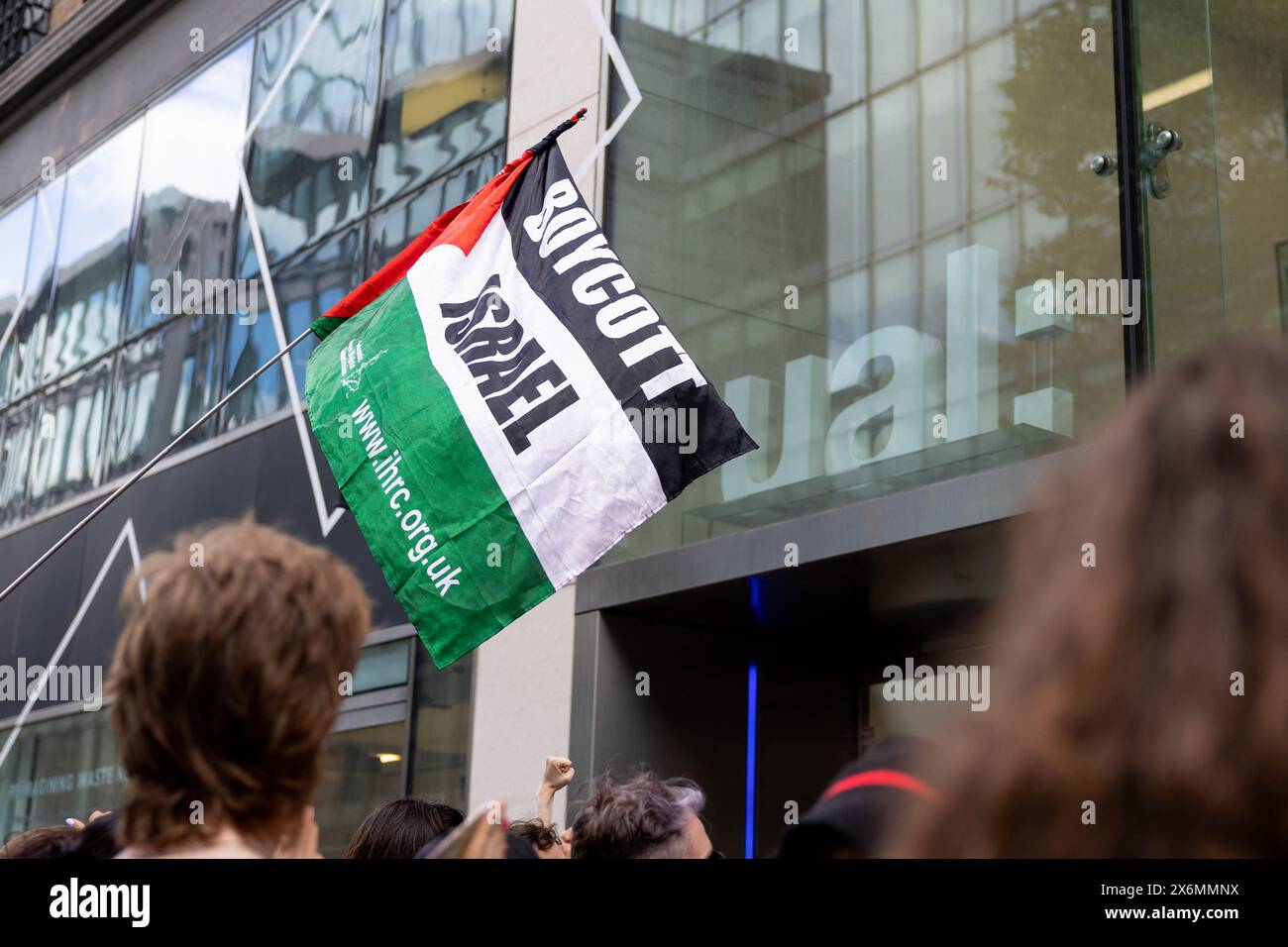 A student is seen waving a Palestinian flag outside the Holborn campus ...