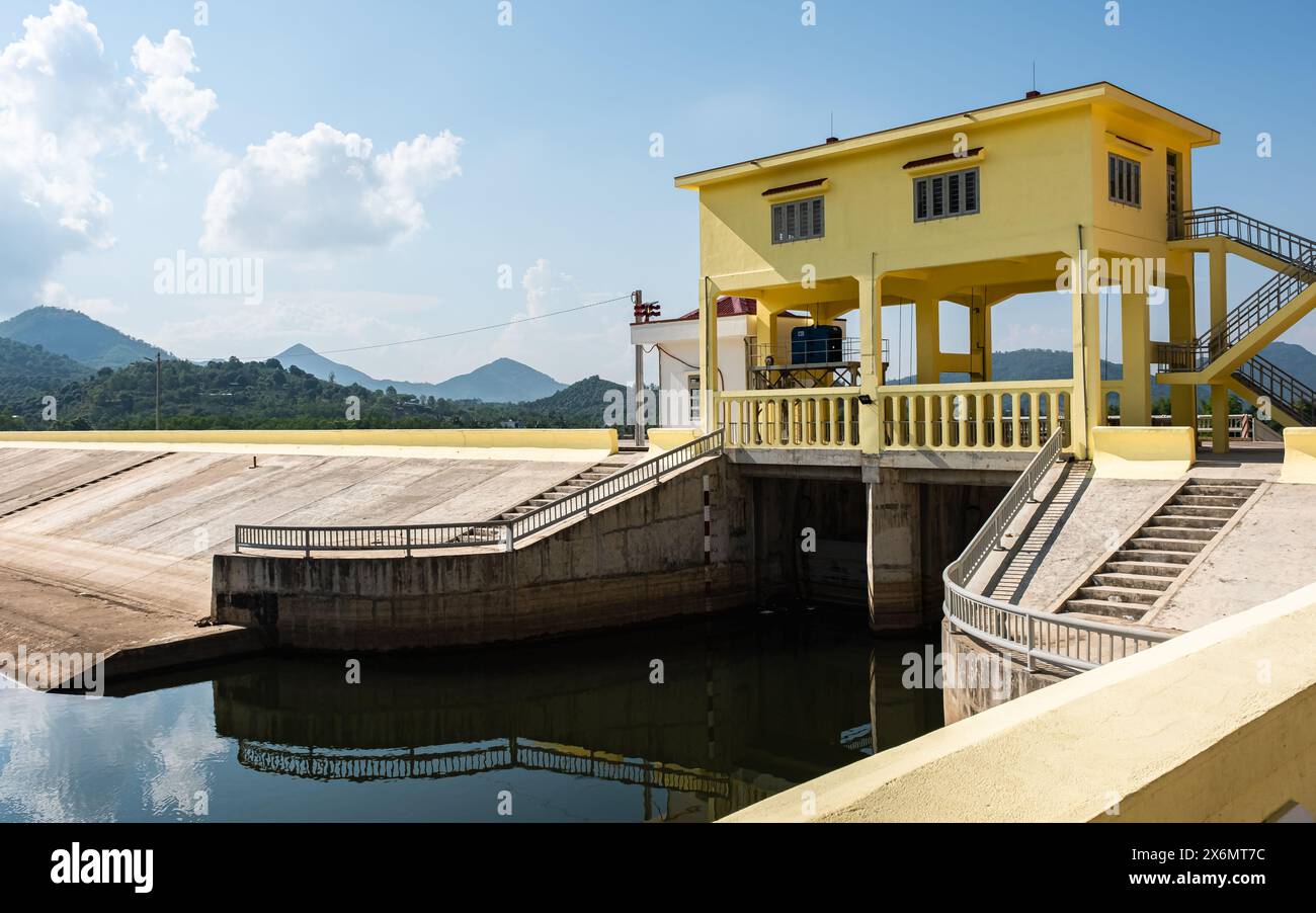 Dam on Lake during sunny day in Asia. View of the river and dam in Nha ...