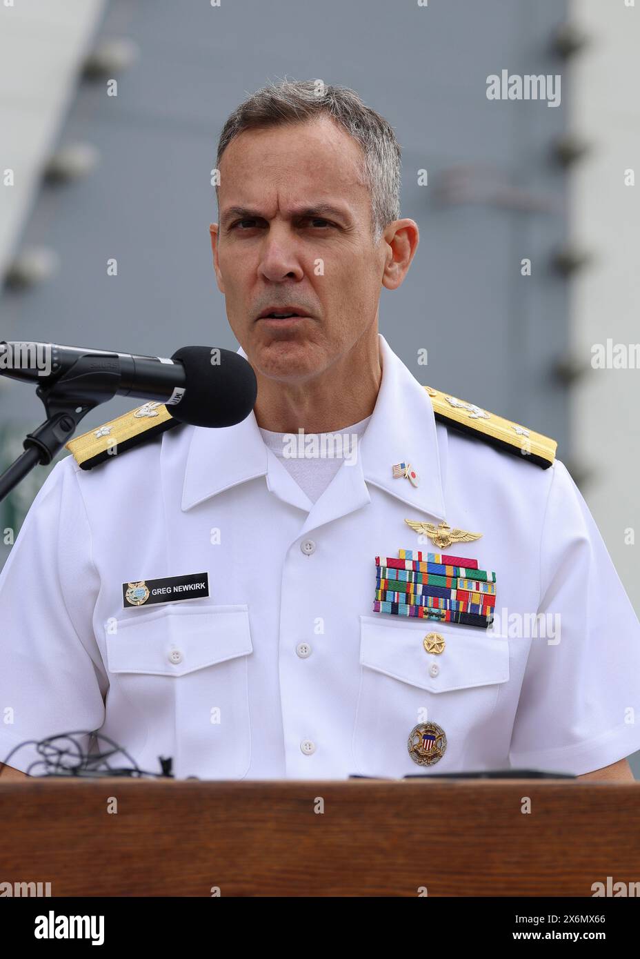 Gregory Newkirk, commander of carrier strike group five, attends a ...