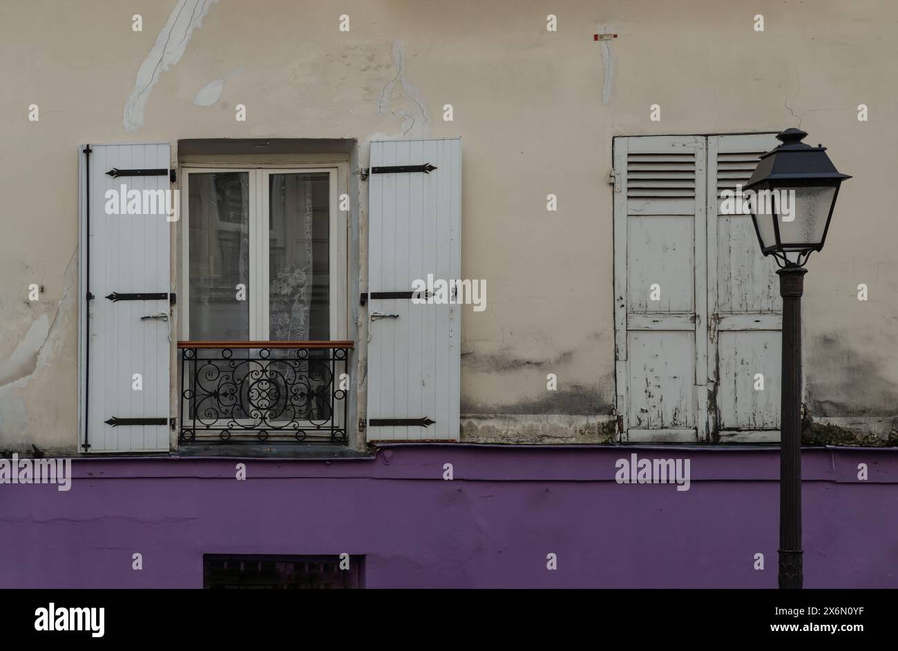 France, Paris - Jan 03, 2024 - Shutters and open window with lace ...