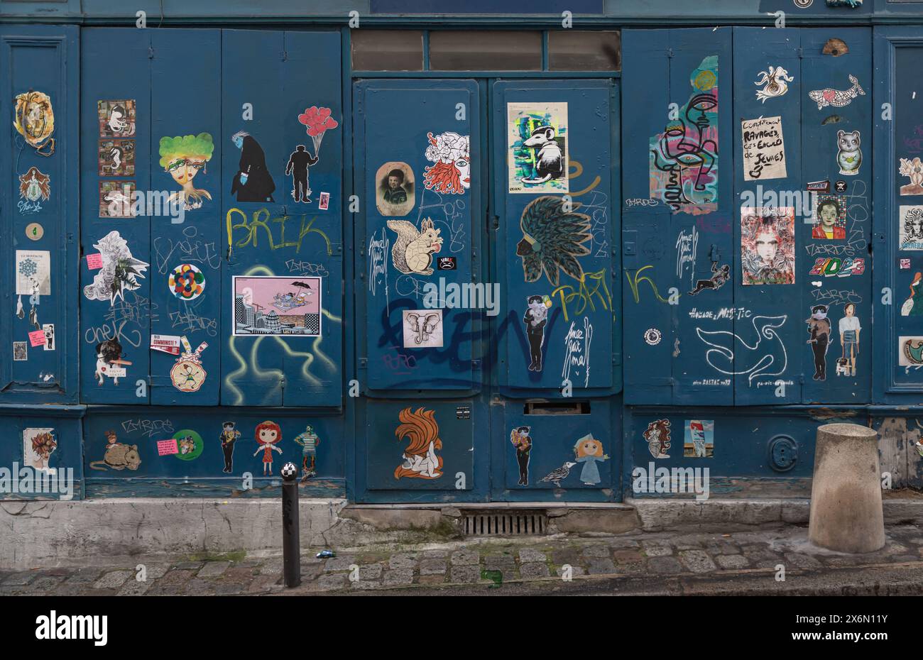 France, Paris - Jan 03, 2024 - A artistic blue metal doorway stickers ...