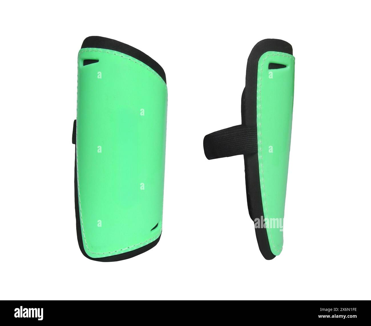 green shin guards pair isolated on white background Stock Photo - Alamy
