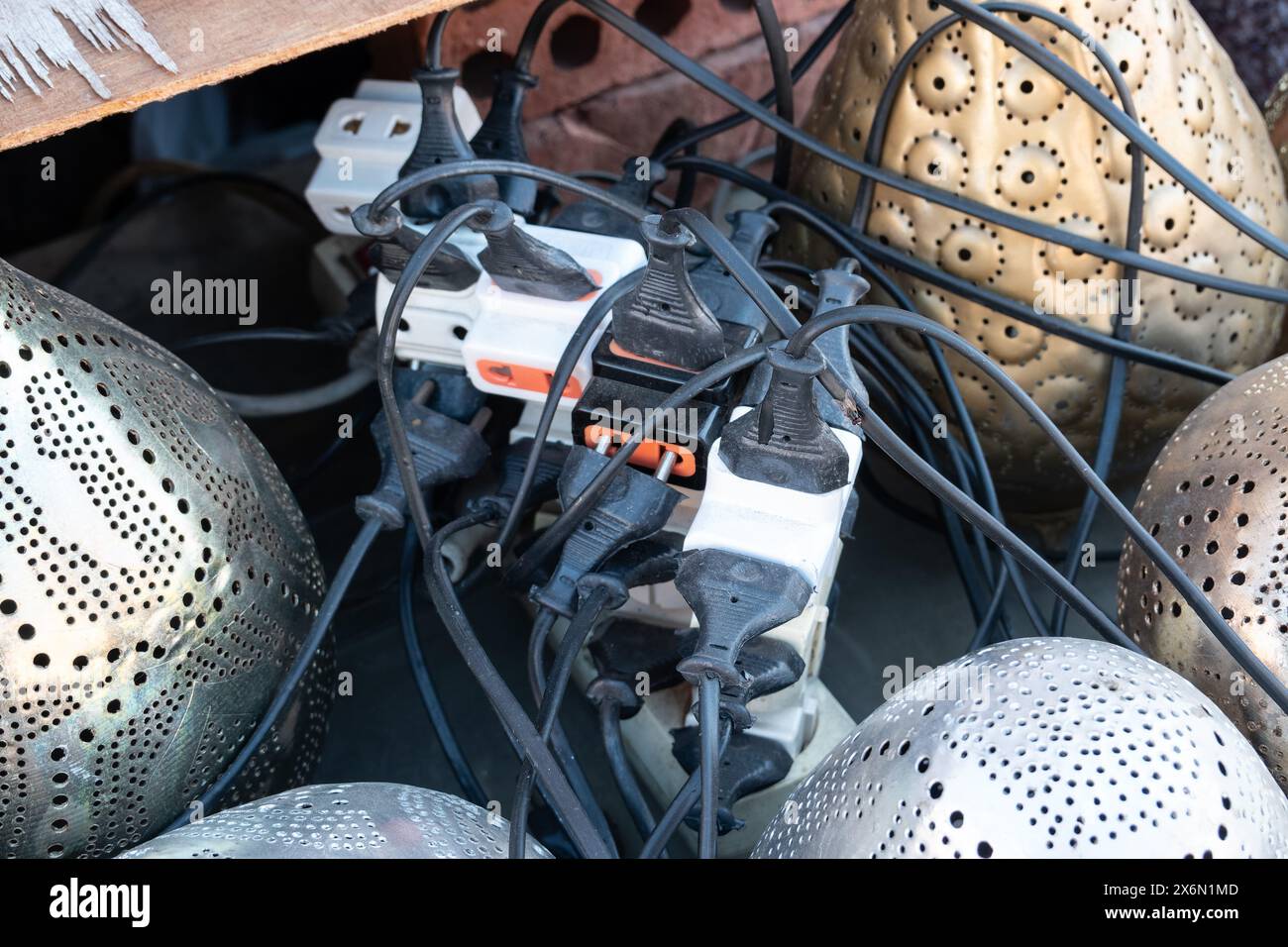 Old and damaged electric adapter power plug has many appliances are ...