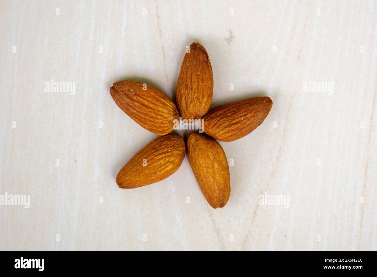 Decorated almonds on wooden background. In the Bengali language, it is ...