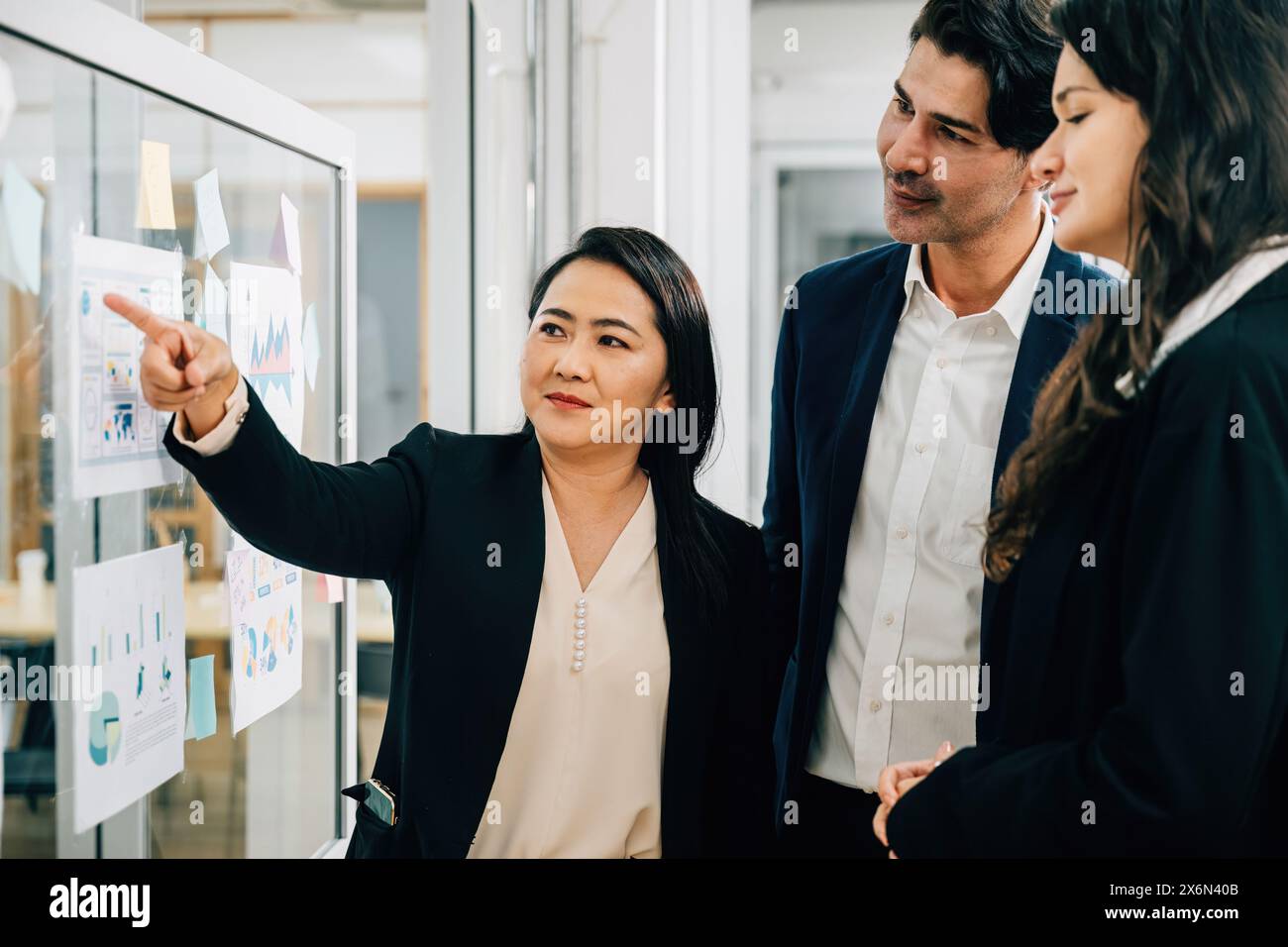 Engaging in teamwork-focused meeting, colleagues actively participate in brainstorming sessions ...