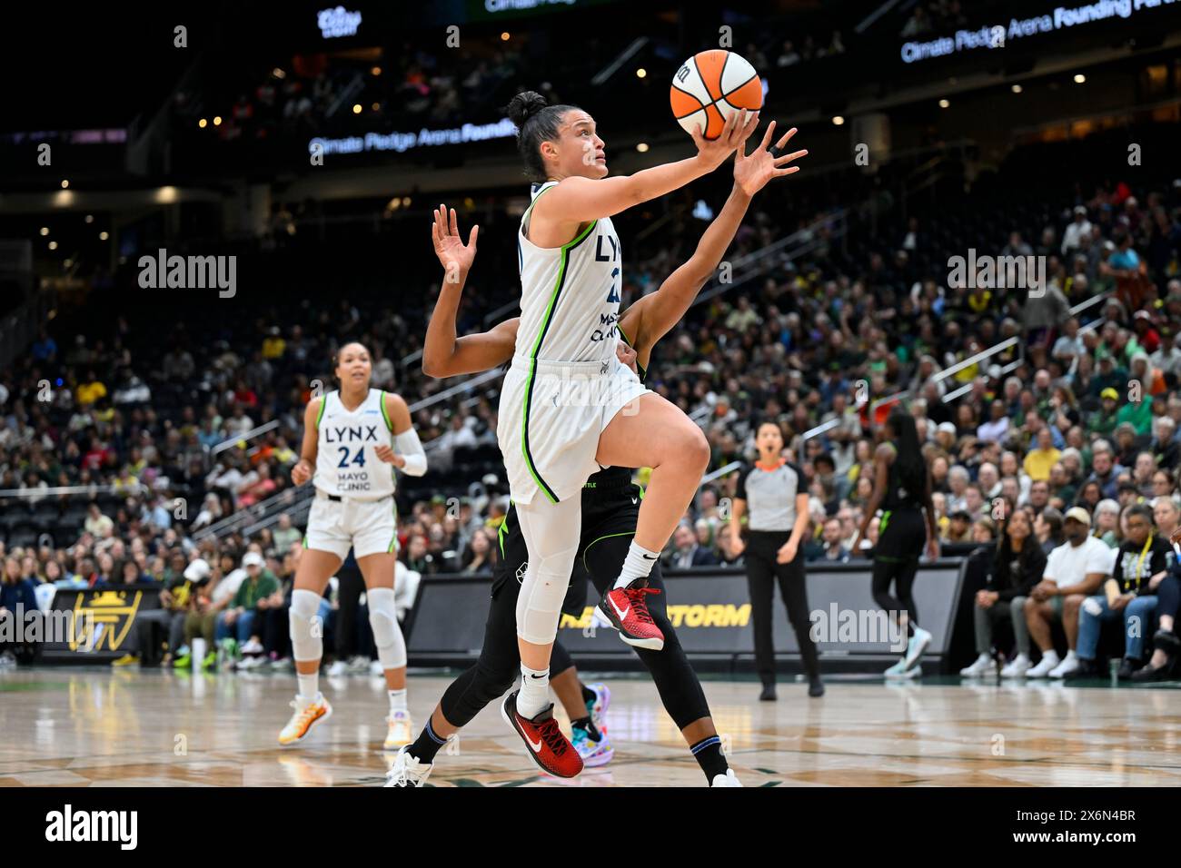 Minnesota Lynx guard Kayla McBride (21) drives against Seattle Storm ...