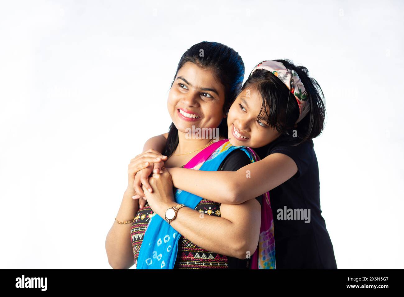 Indian mother and child daughter embracing hugging each other with ...