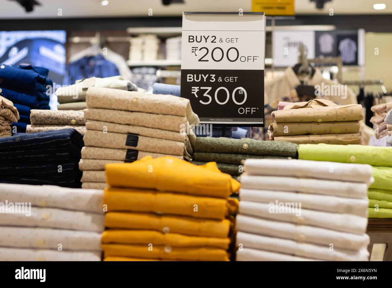 A rack in a shopping mall of India containing colorful polo t-shirts ...