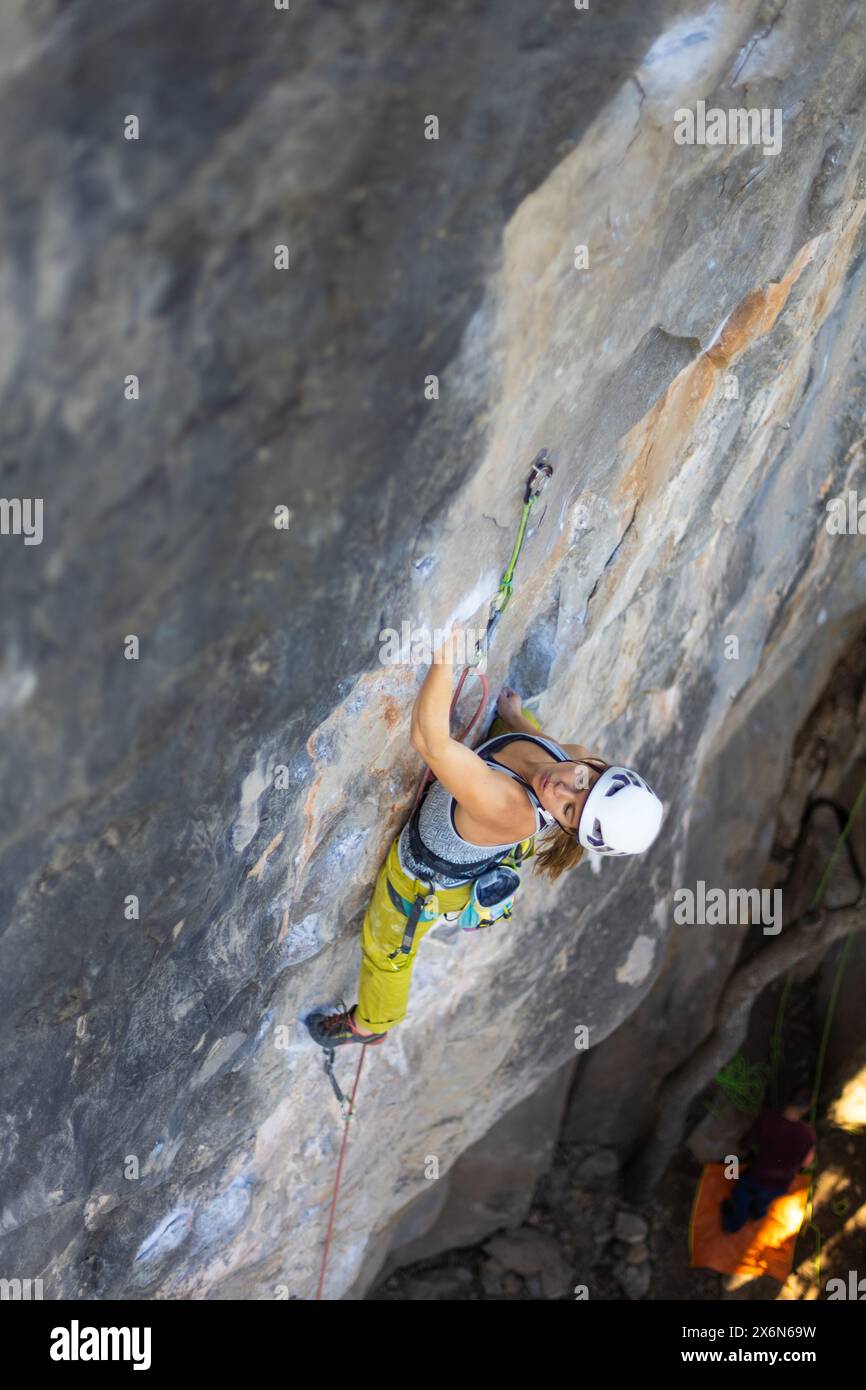 Women climbing in mountains, courage safety and determination Stock ...