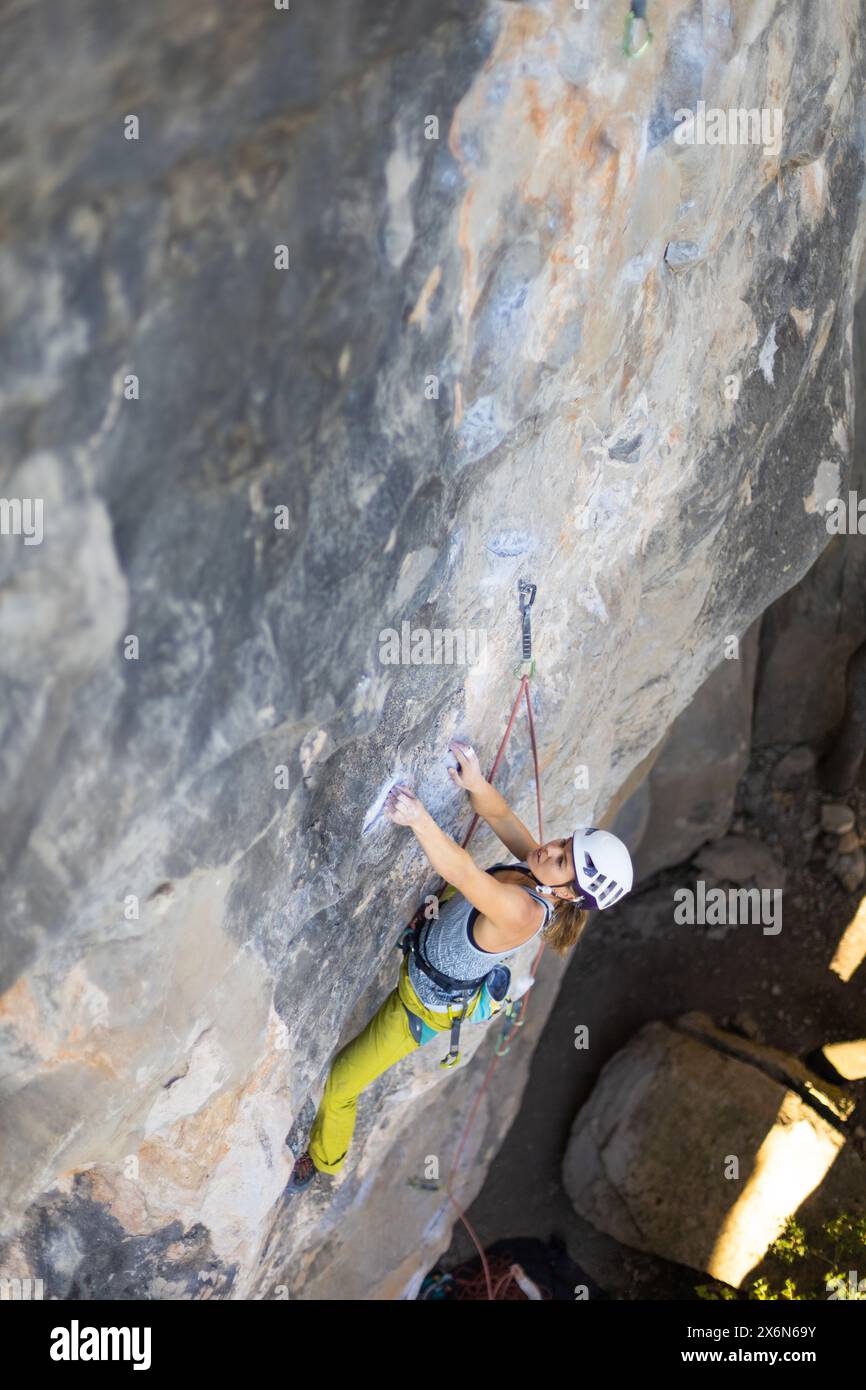 Women climbing in mountains, courage safety and determination Stock ...