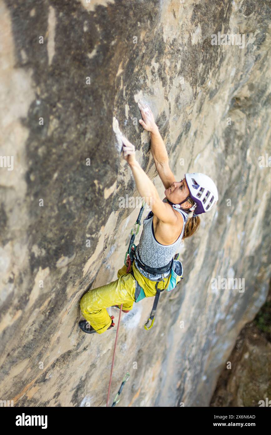 Women climbing in mountains, courage safety and determination Stock ...
