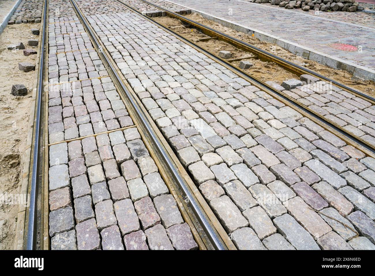 Tram rails have just been replaced and the intermediate track surface ...