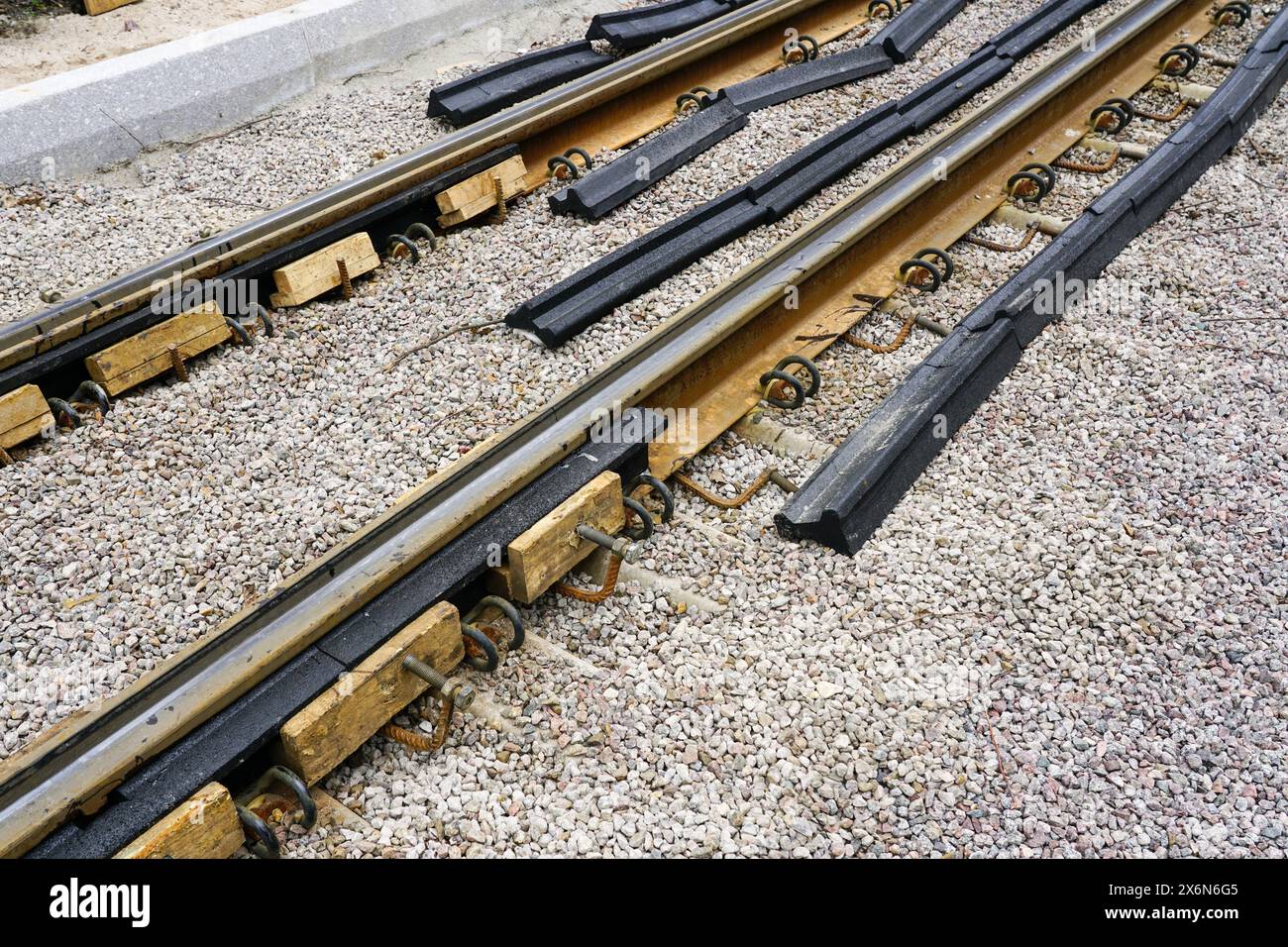 Attaching black polyurethane pads to new tram rails to reduce vibration ...