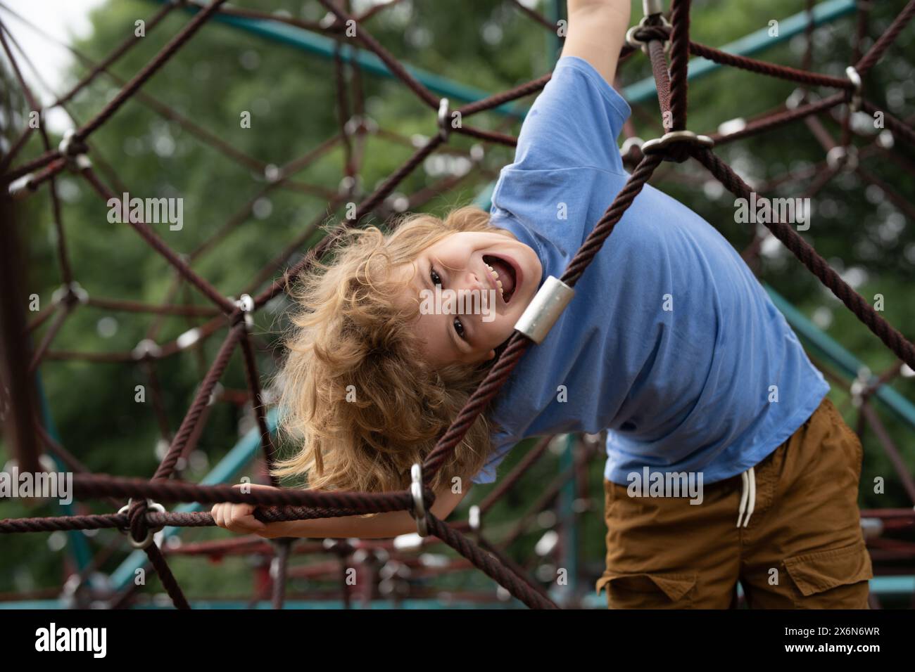 The outdoor playground for children in summer park. Kid play on ...