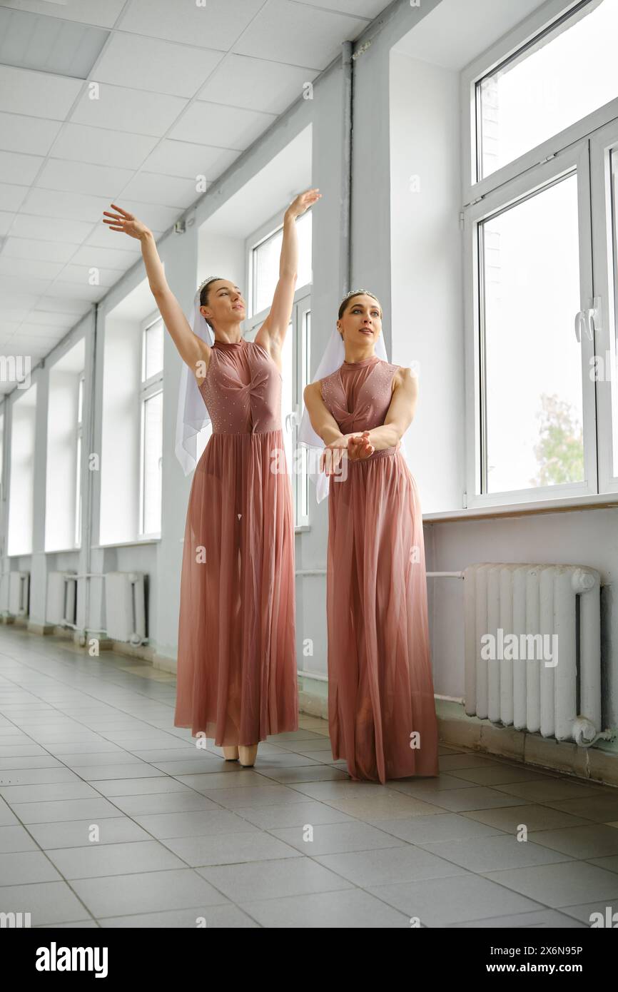 Two ballet dancers rehearsing choreography in the hallway Stock Photo ...