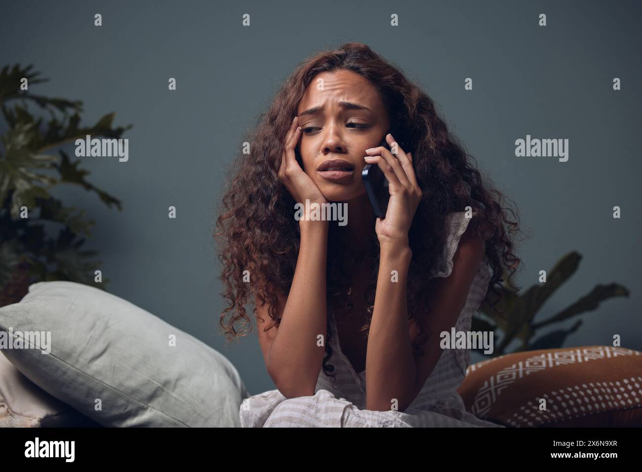 Woman, crying and stress with phone call for help, support and ...