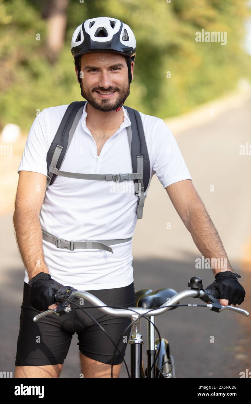Handsome young cyclist posing hi-res stock photography and images - Alamy