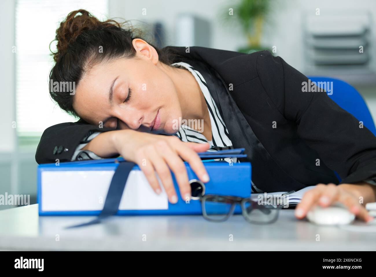 exhausted and tired female sleeping in office Stock Photo - Alamy