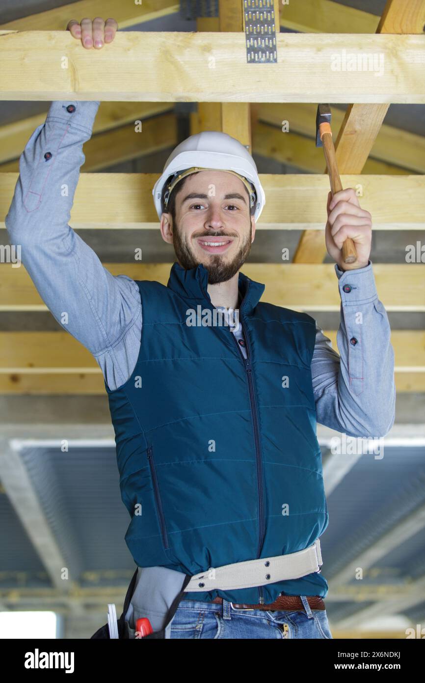contractor repair uses a hammer in wood structure Stock Photo - Alamy
