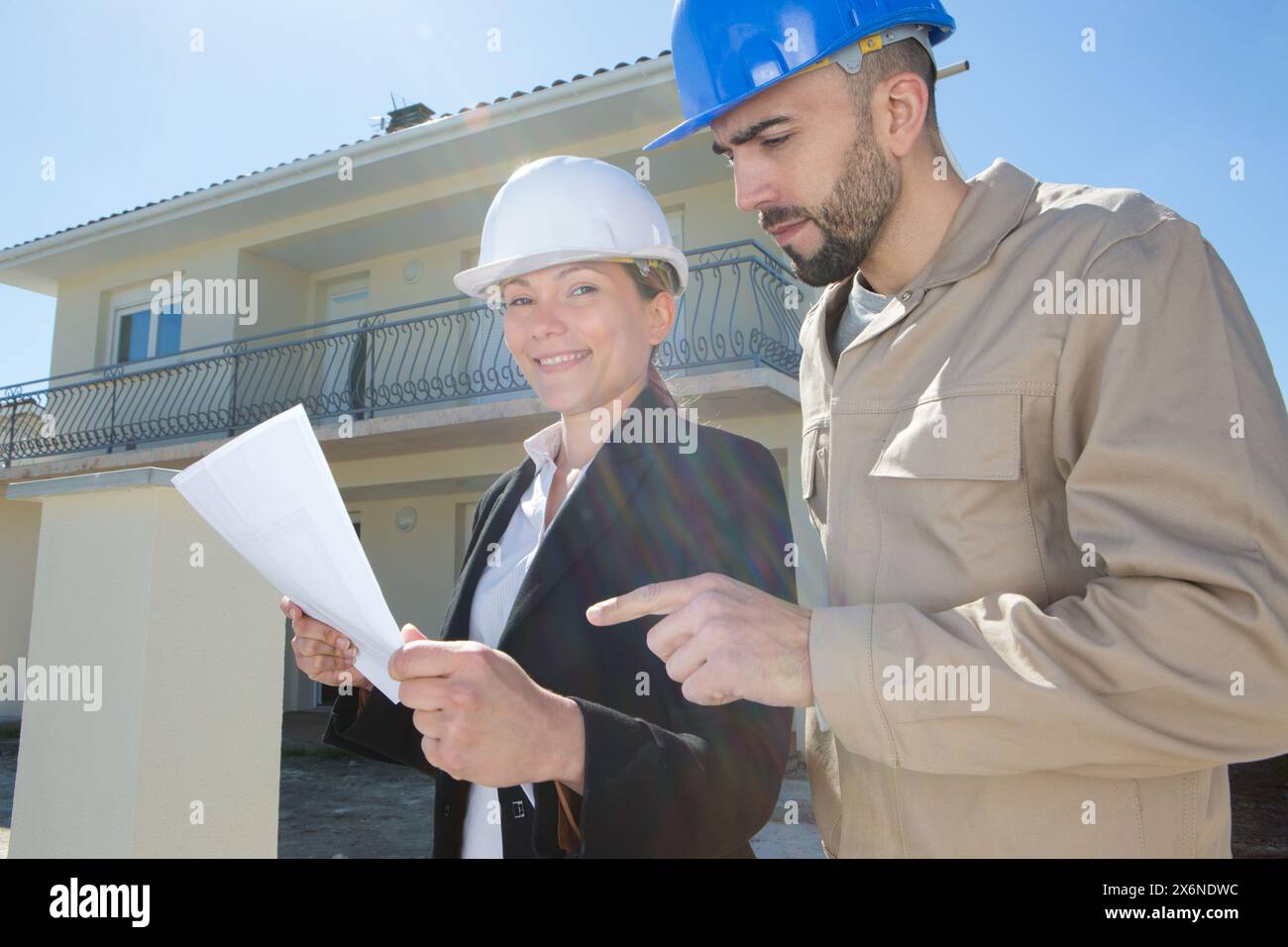 Male female civil engineers examining hi-res stock photography and ...