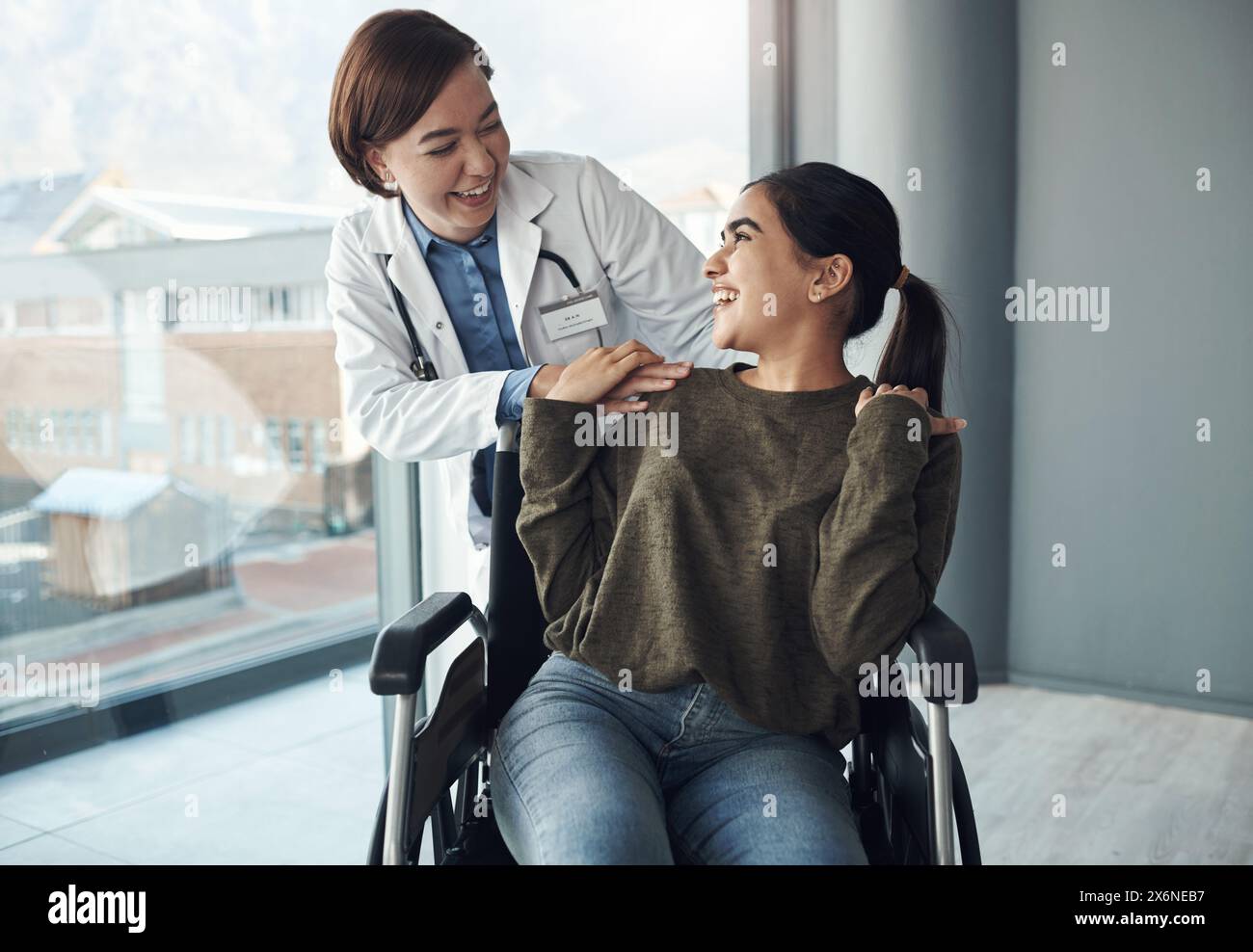 Wheelchair, doctor and care for patient with disability in hospital for ...
