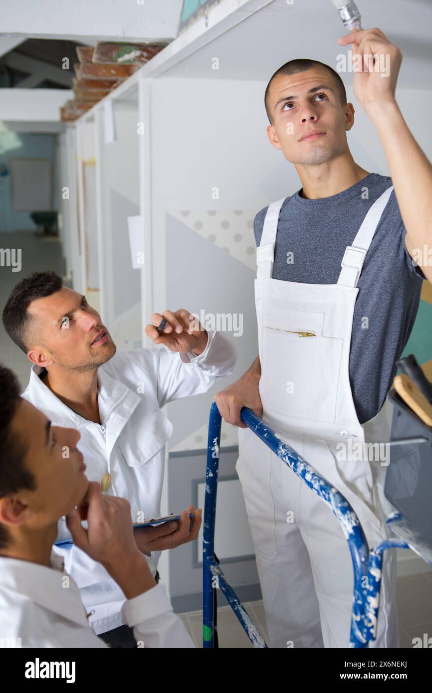 male apprentice painter at work Stock Photo - Alamy