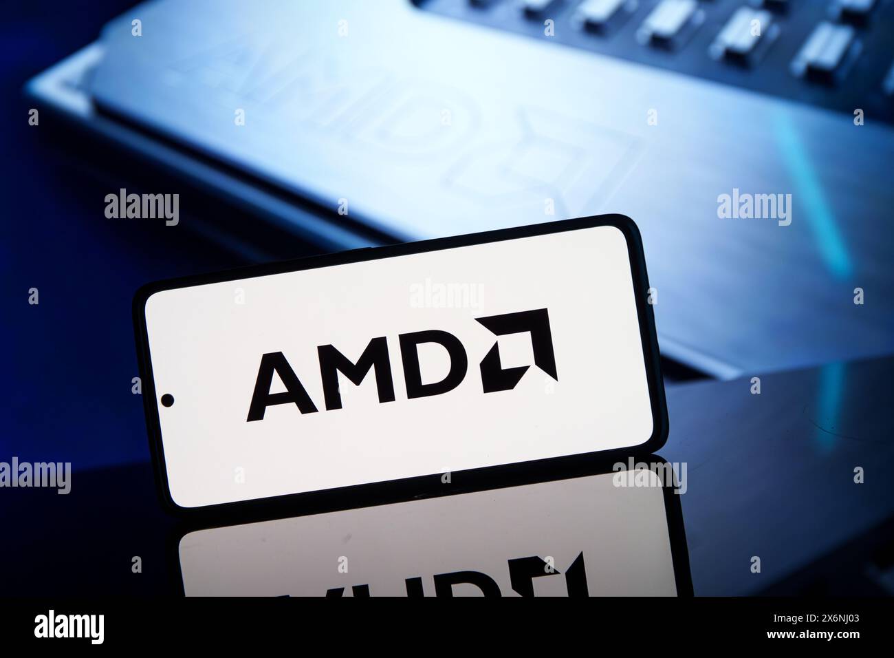 AMD company logo shown on phone screen. Advanced Micro Devices Stock ...