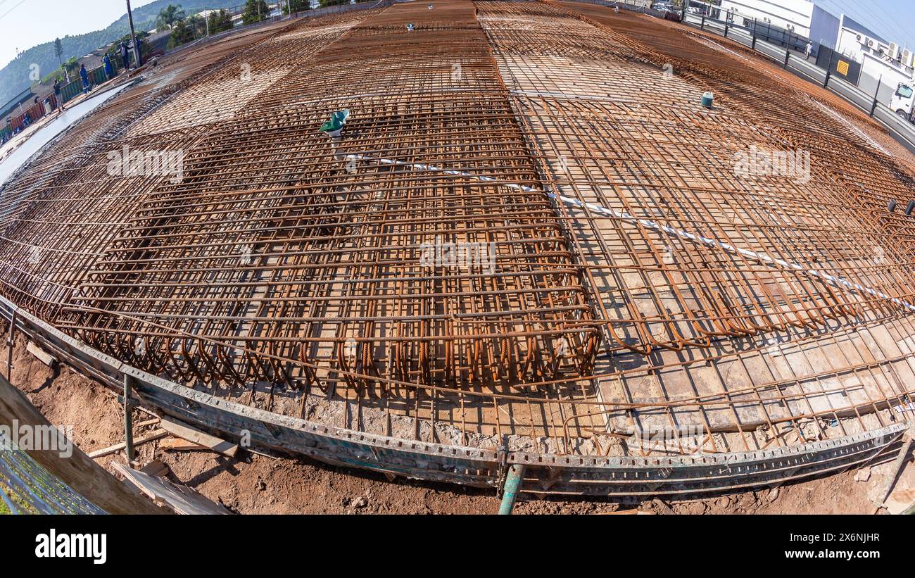 Construction concrete pouring onto steel rebar flooring of new ...